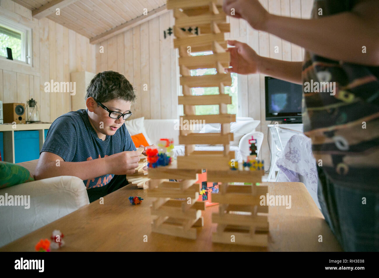 Boy playing with wooden blocks hi-res stock photography and images - Alamy