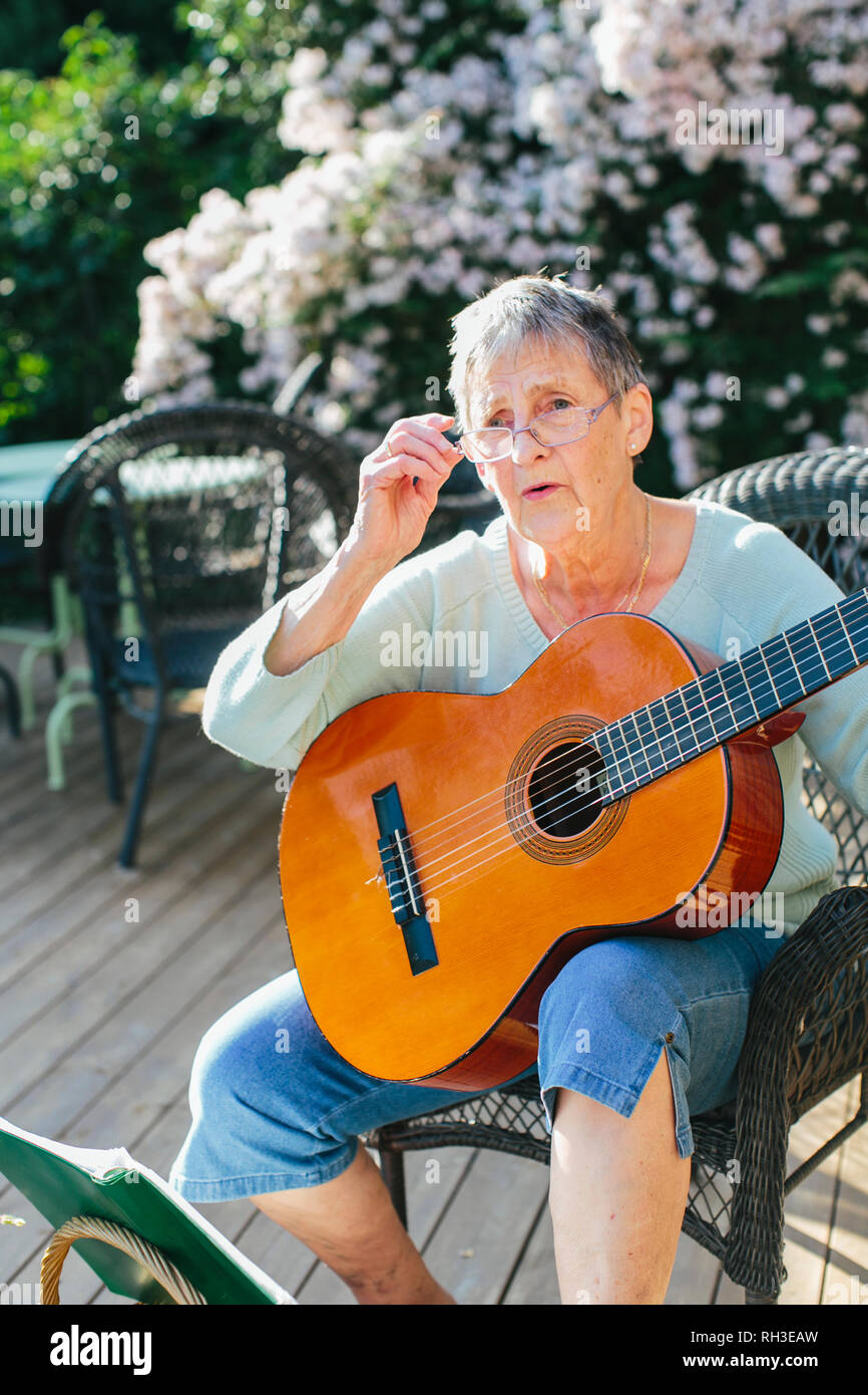 Old woman playing hi-res stock photography and images - Alamy