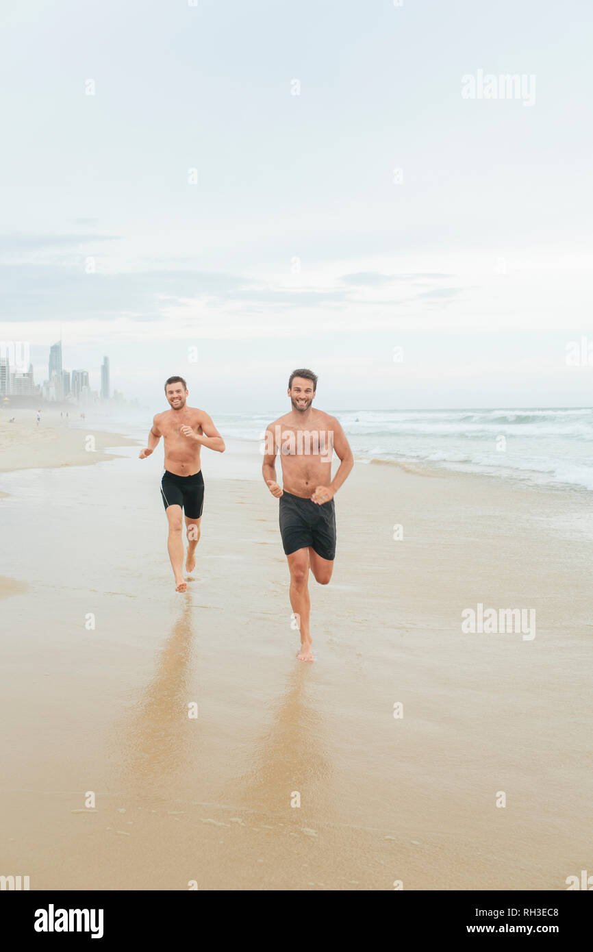 Muscle Men Beach High Resolution Stock Photography and Images - Alamy