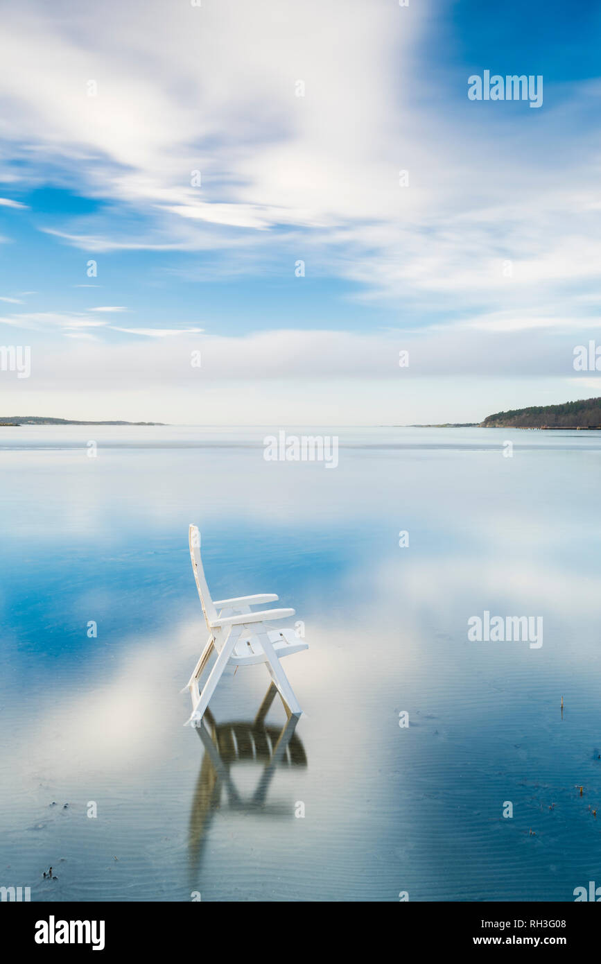 White lounge chair in sea Stock Photo - Alamy
