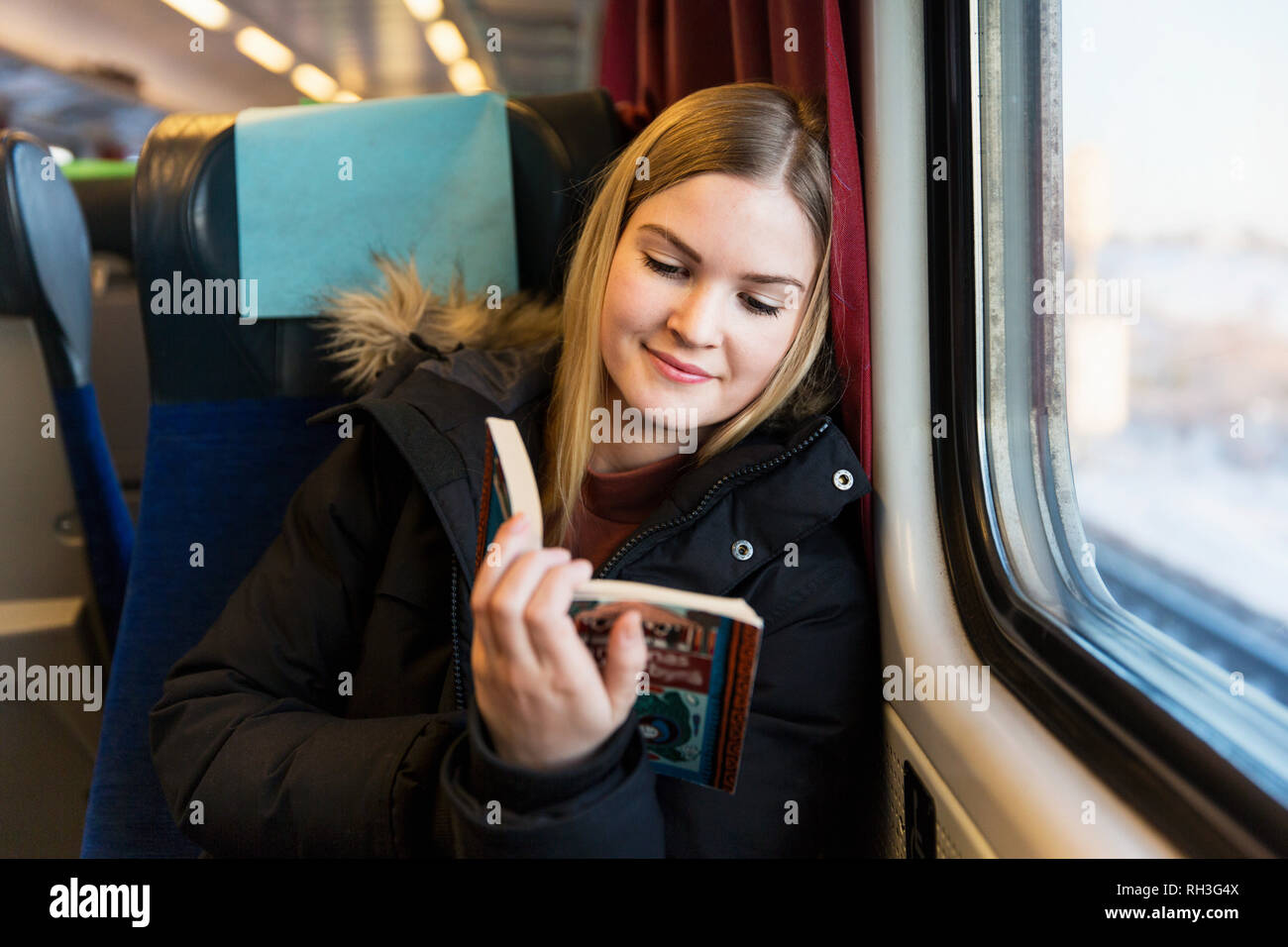 Reading book train hi-res stock photography and images - Alamy