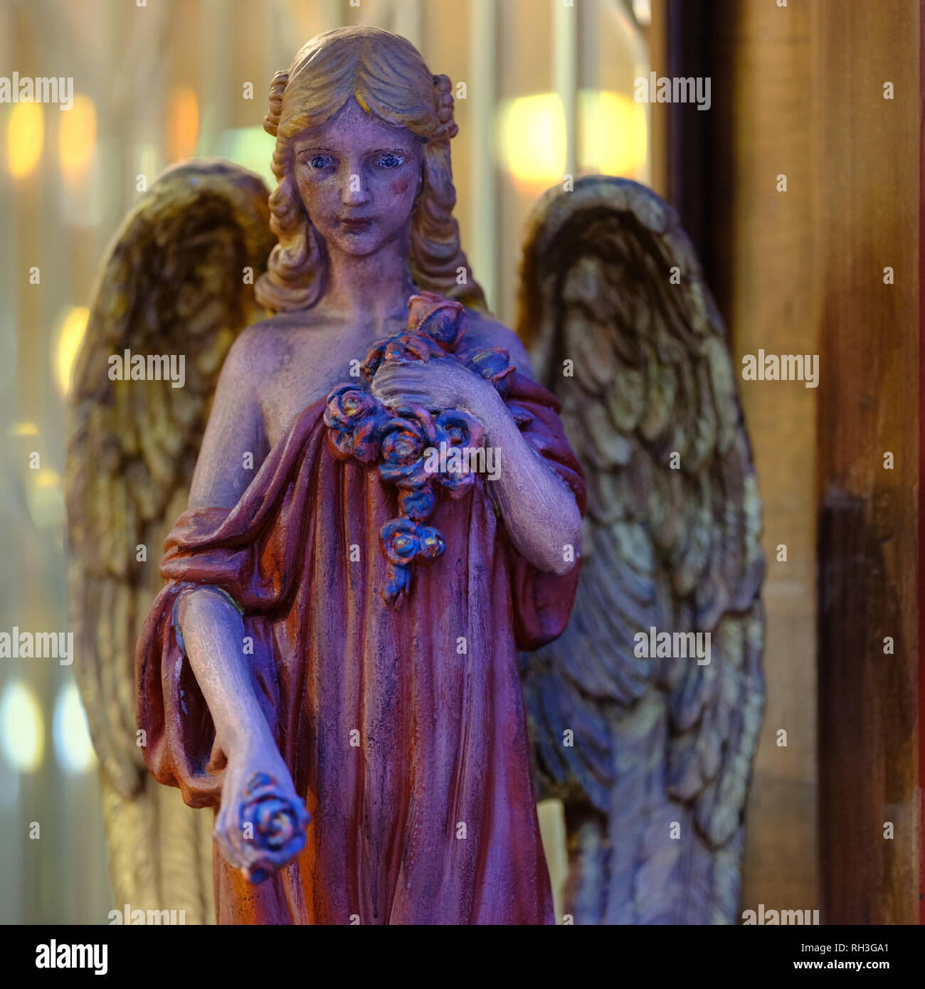 Plaster Figure of Female Angel with pink dress and golden wings holding ...