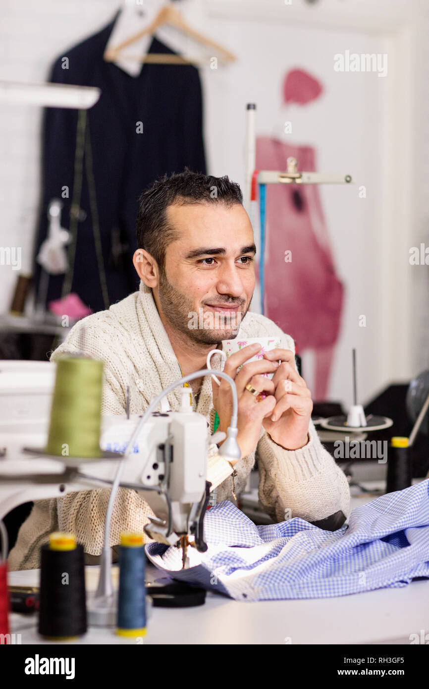 Tailor in studio Stock Photo - Alamy