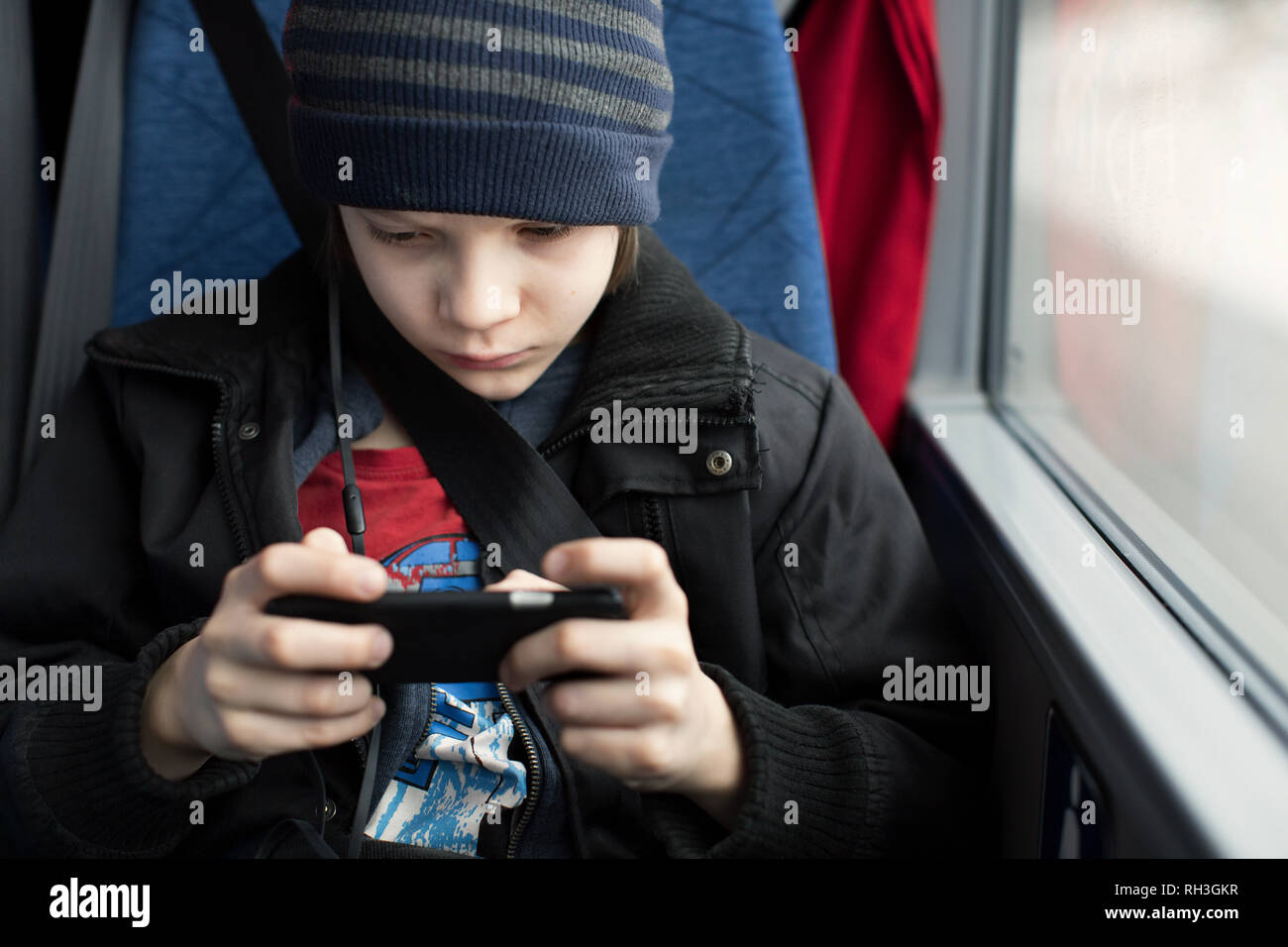 Boy with cell phone Stock Photo - Alamy