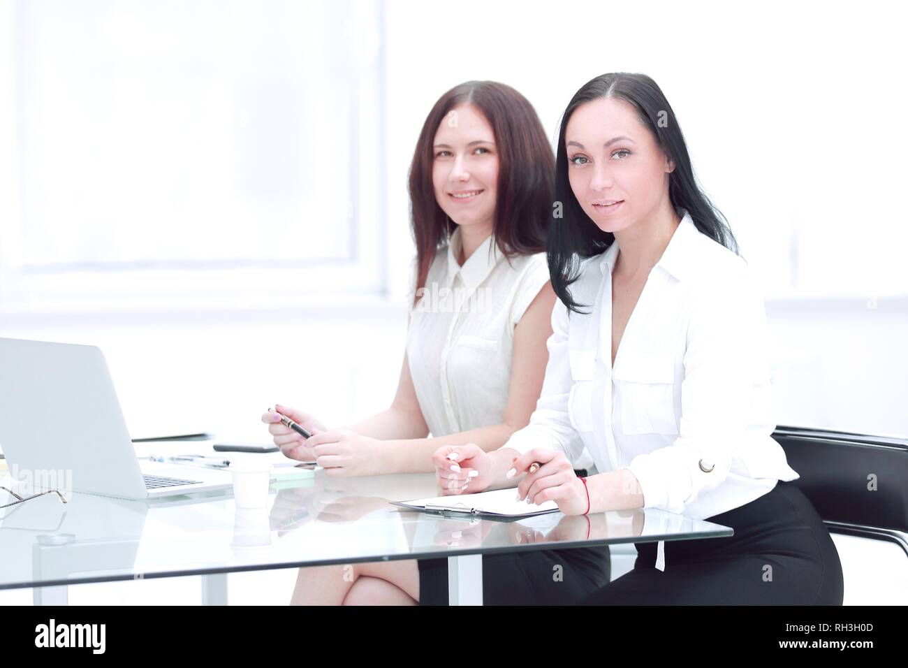 business woman and her assistant at the office Desk Stock Photo - Alamy