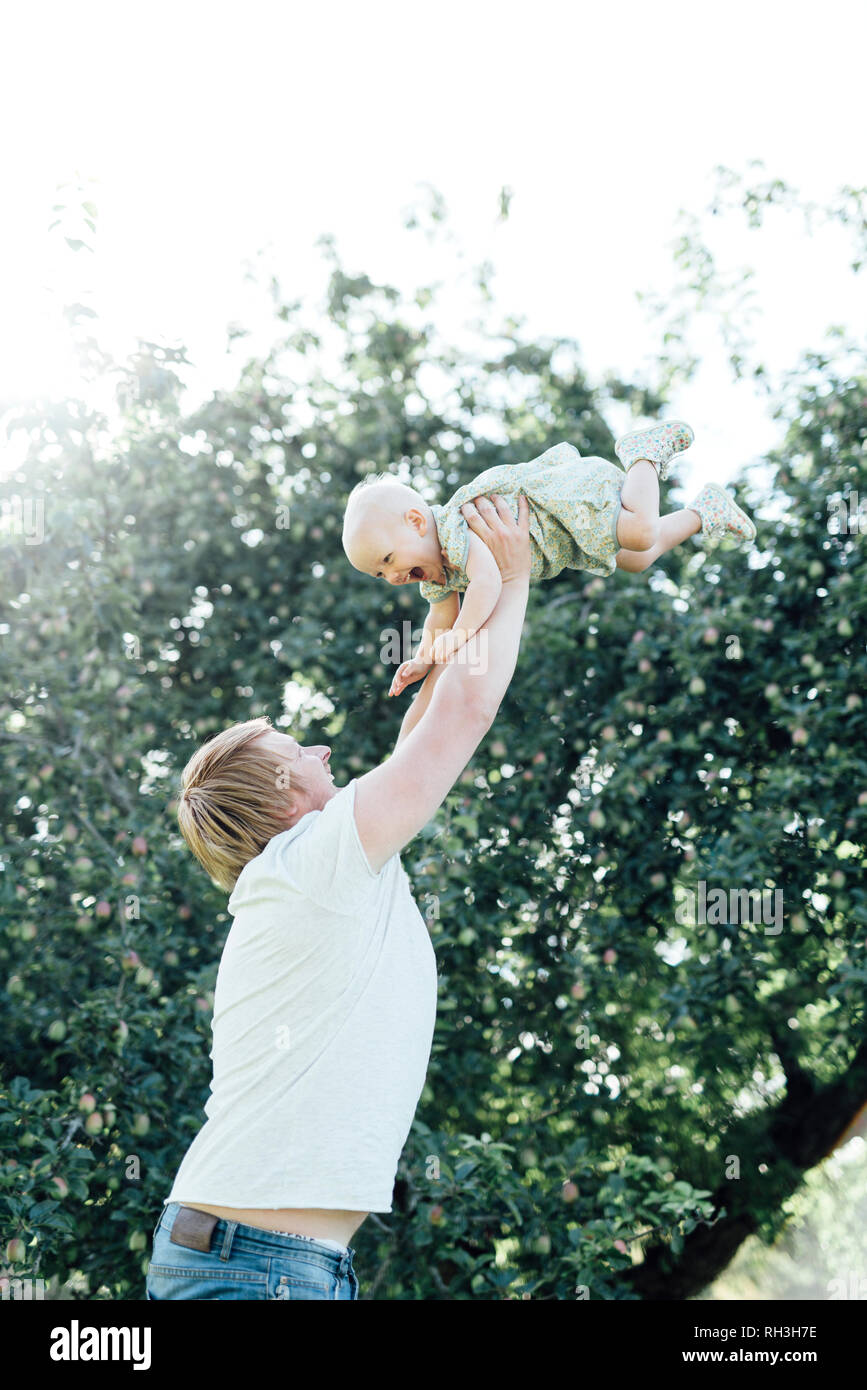 Father playing with baby daughter Stock Photo - Alamy