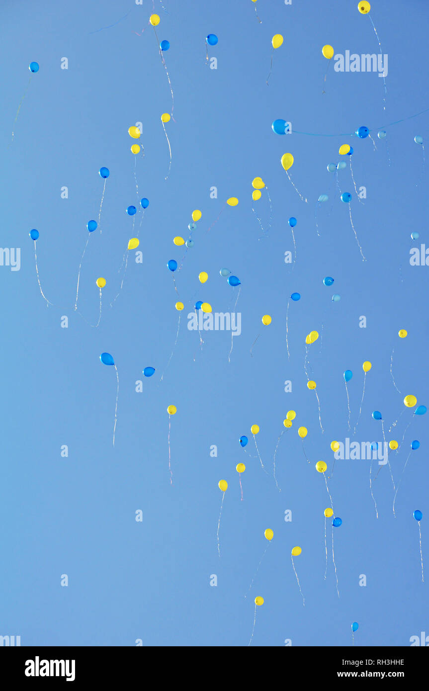 Blue and yellow balloons hi-res stock photography and images - Alamy