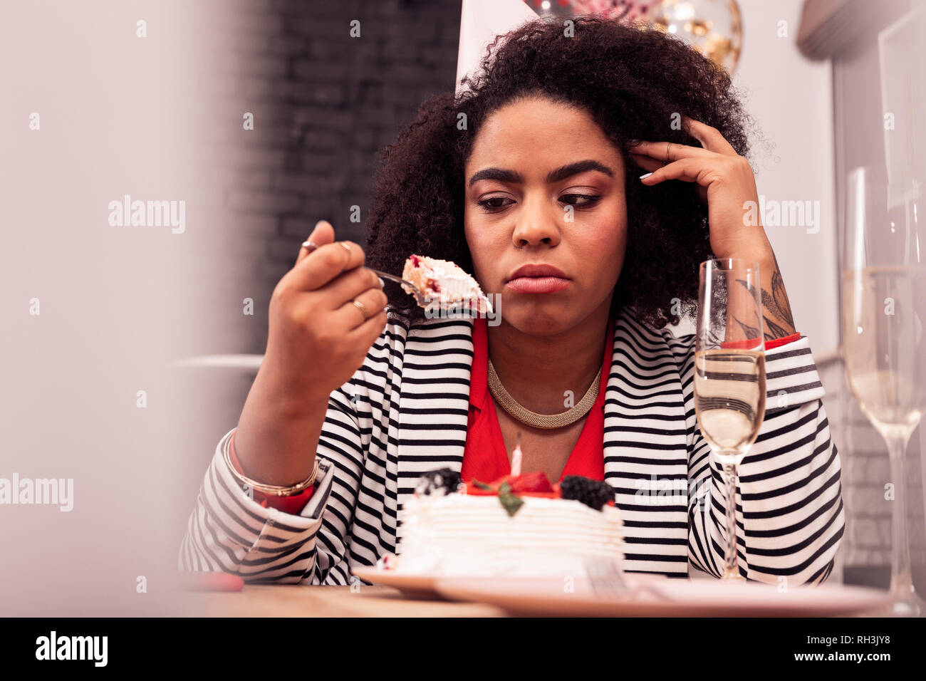 Cheerless upset woman celebrating her birthday alone Stock Photo - Alamy