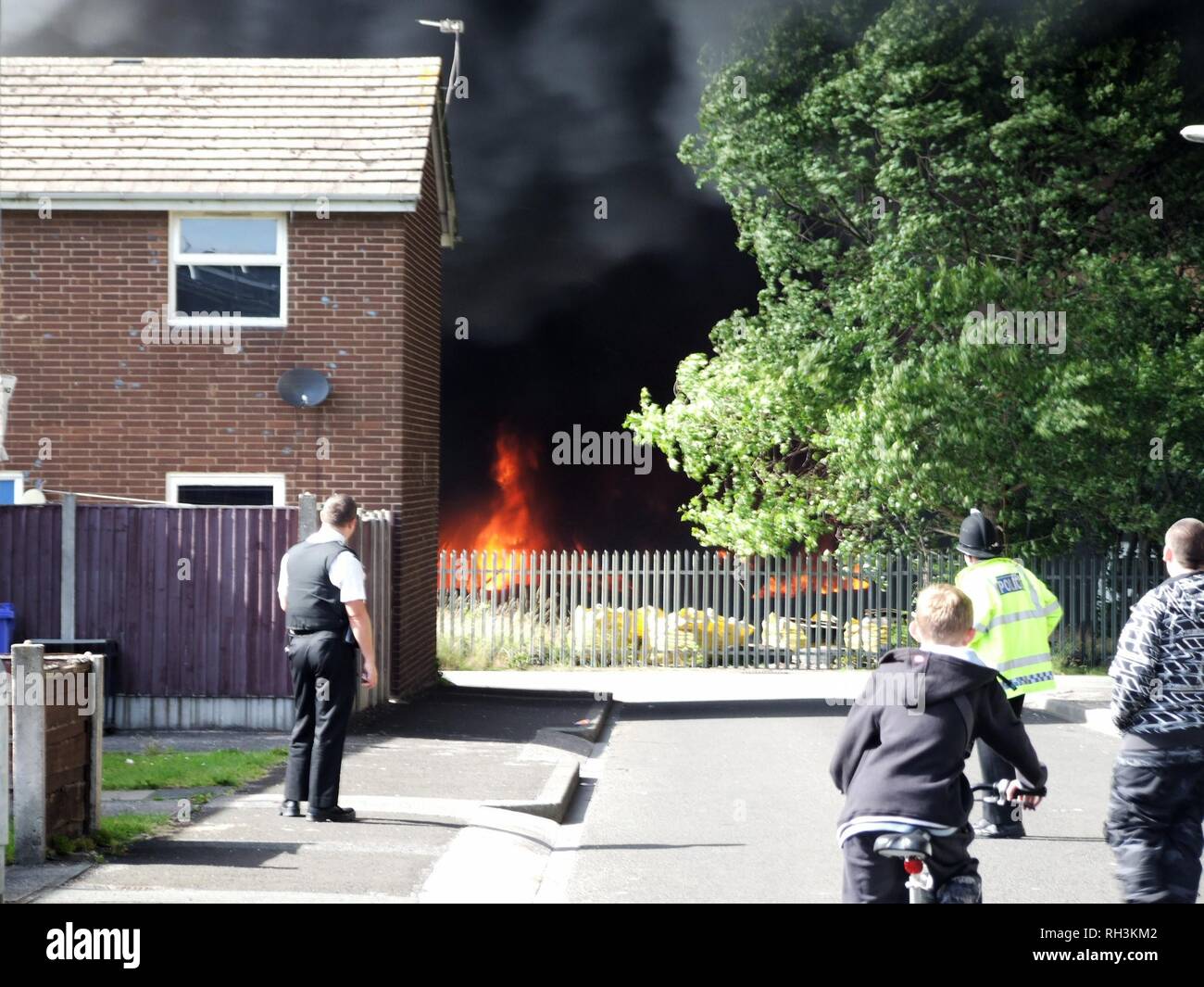 House residents watching fire on industrial estate hi-res stock ...