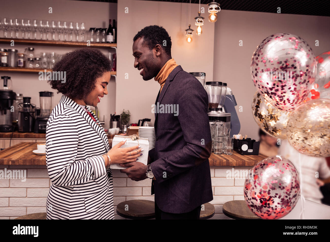 Woman taking gift from hi-res stock photography and images - Alamy