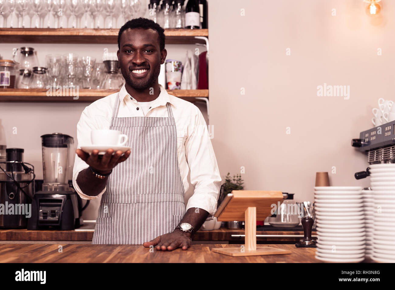 Man offering coffee cup hi-res stock photography and images - Alamy
