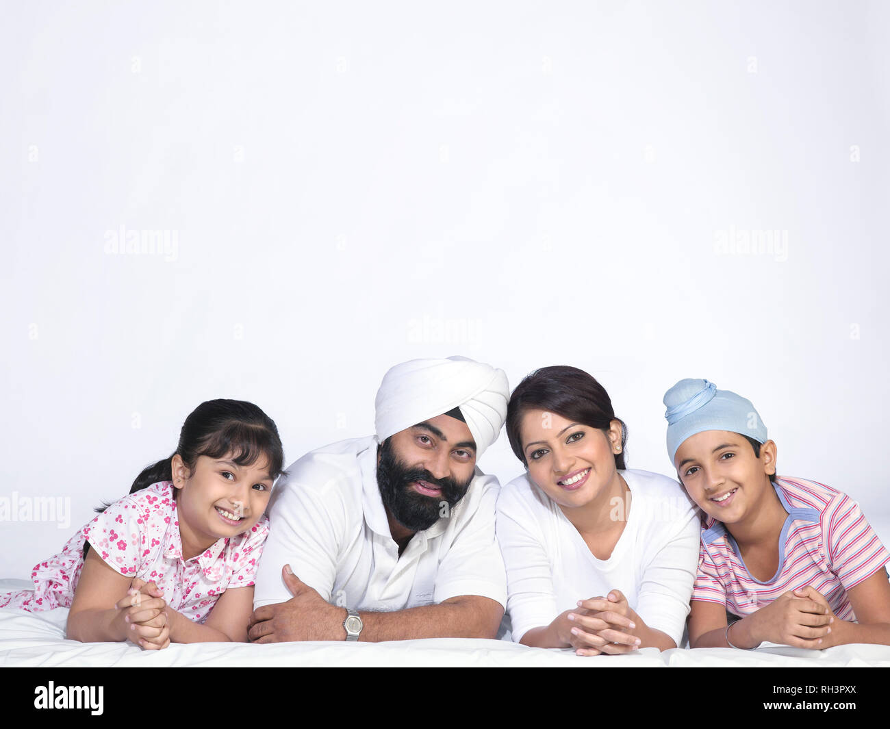 PORTRAIT OF A SIKH SARDAR FAMILY OF FOUR Stock Photo - Alamy