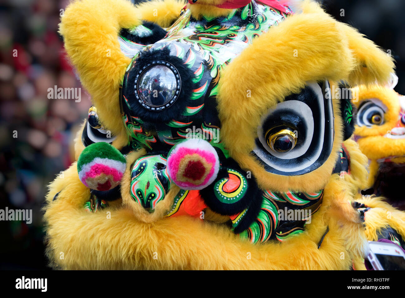 Chinese lion dance costume close up with people in background Stock ...