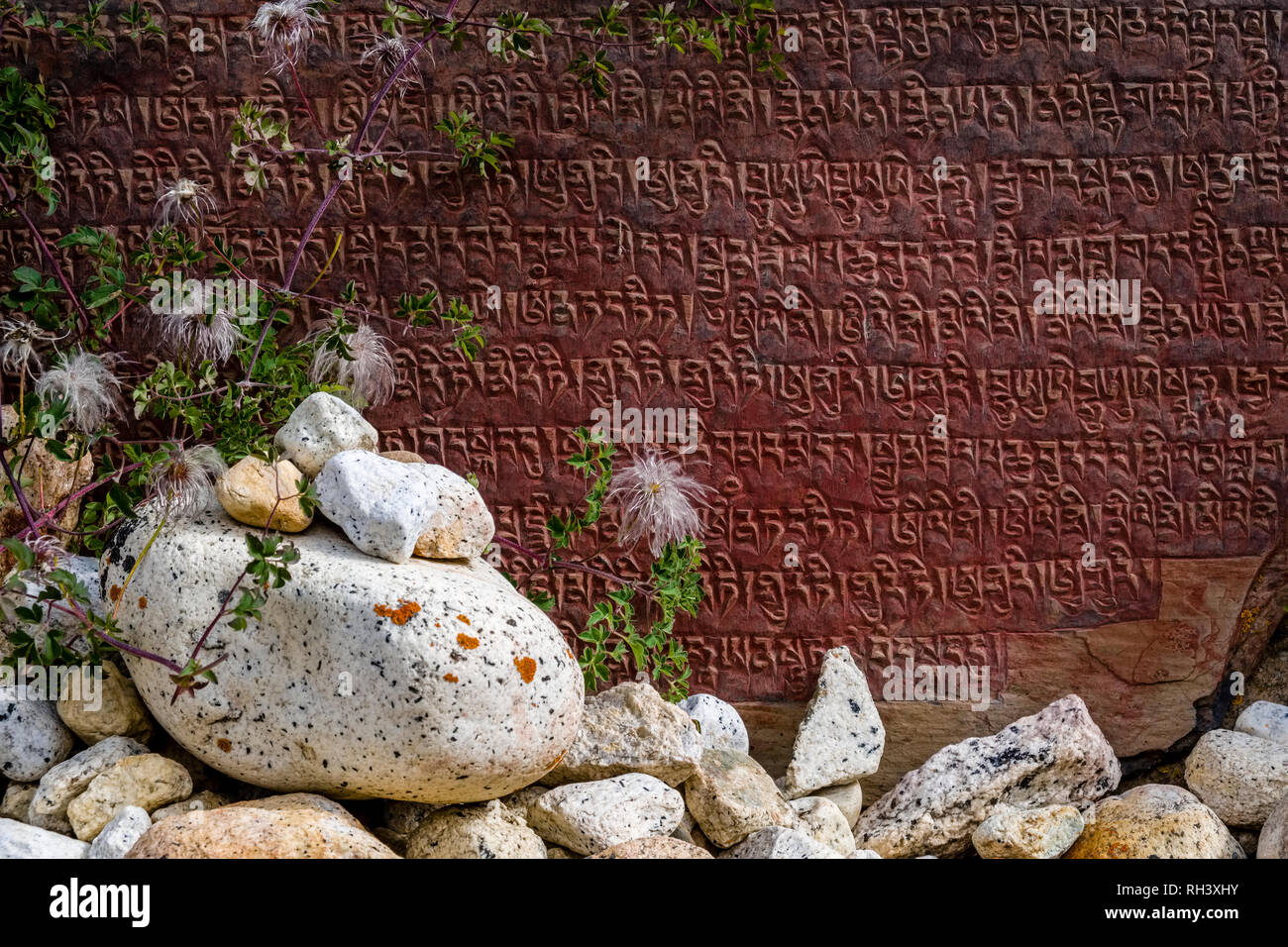 Colorful Mani Stone with the rock carved buddhist mantra of ...
