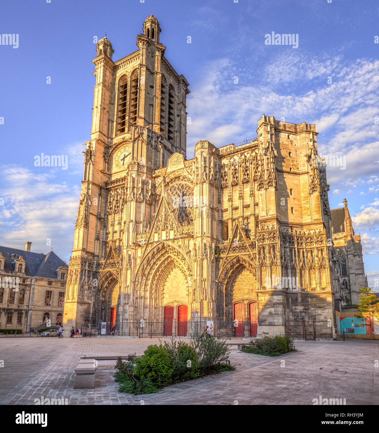 Beautiful Troyes cathedral with large clock in sunlight, summer France ...