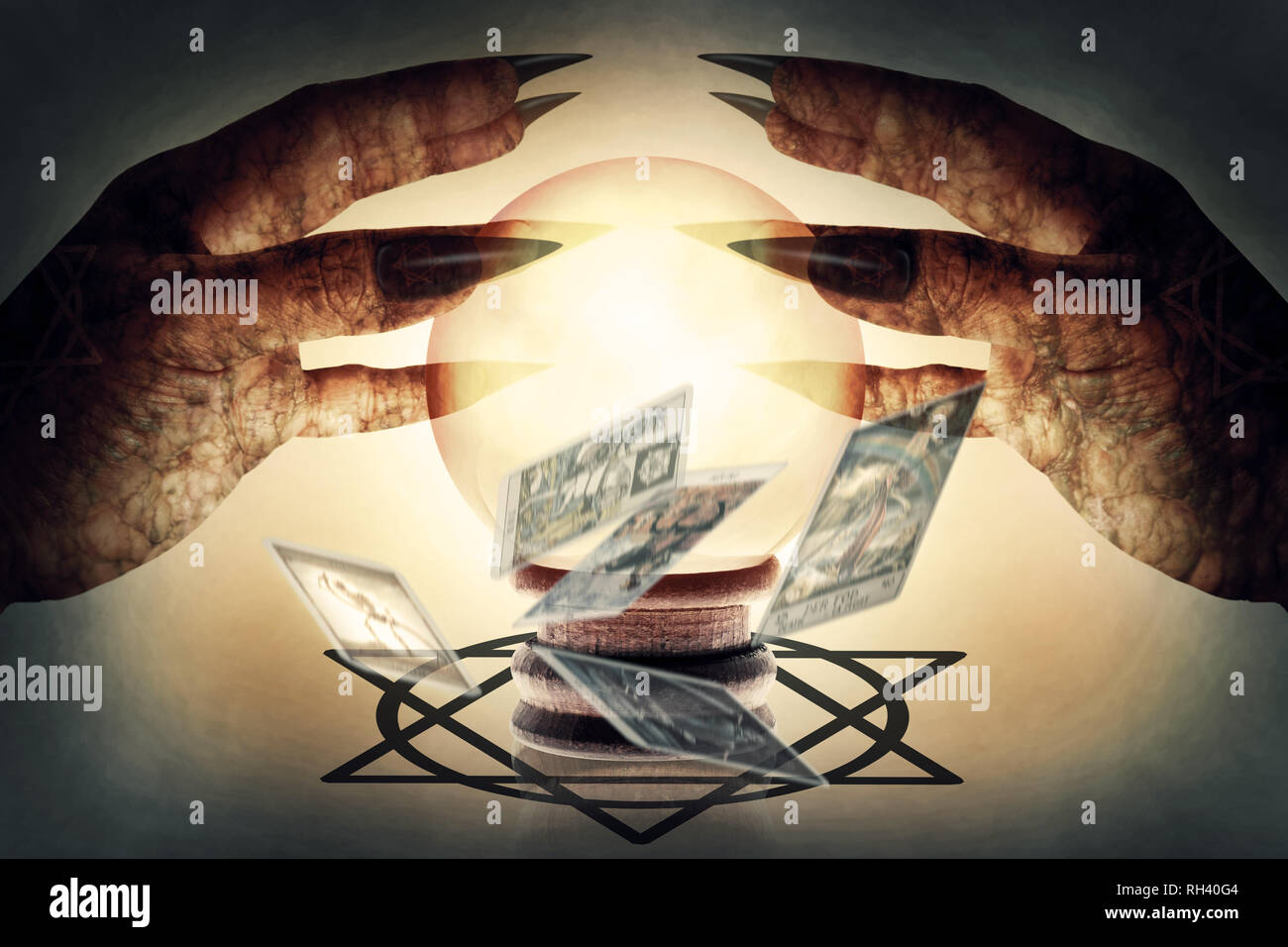 Crystal ball and devil hand with tarot cards (The Death) falling on ...