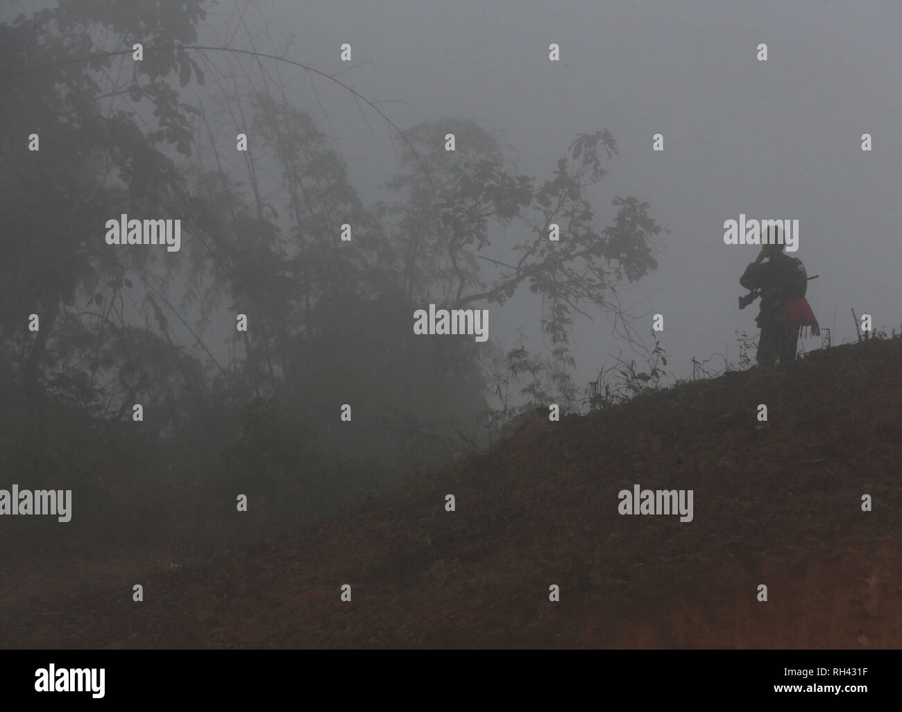 A Karen National Union (KNU) soldier seen on guard during the ceremony ...