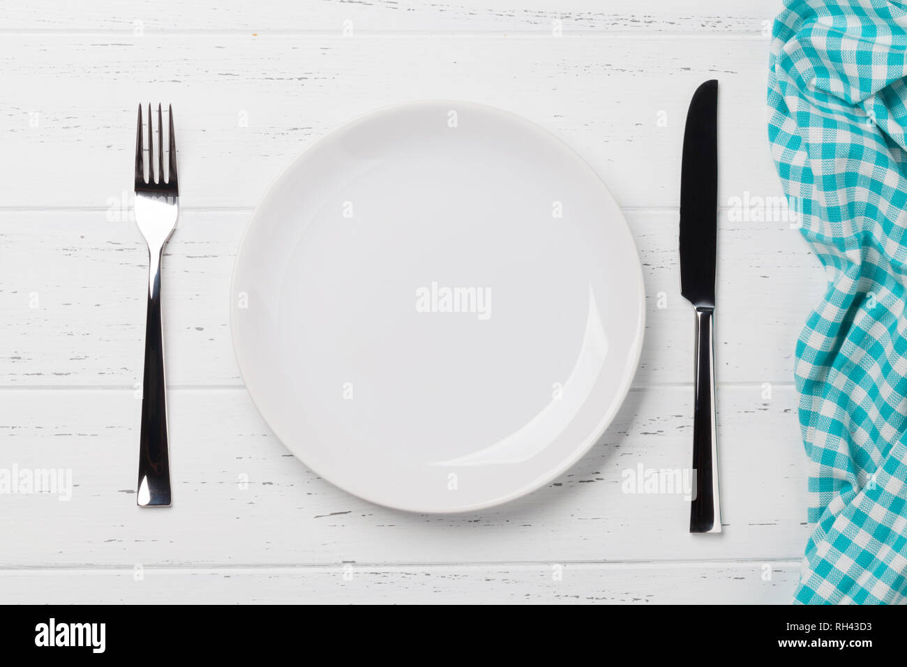 Dinner plate setting with cutlery. Top view with copy space. Flat lay ...