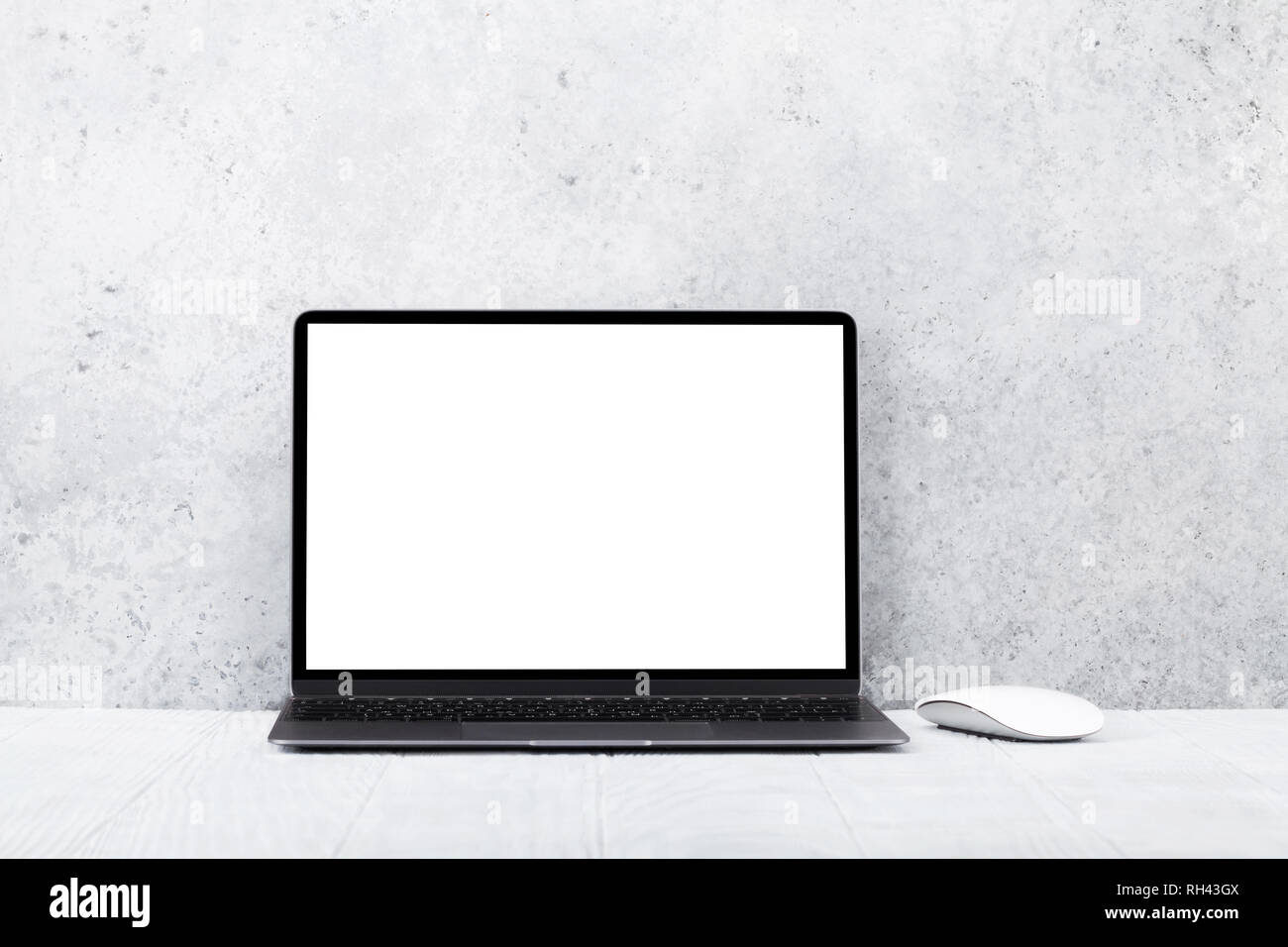 Loft home office workplace with blank white screen laptop computer ...