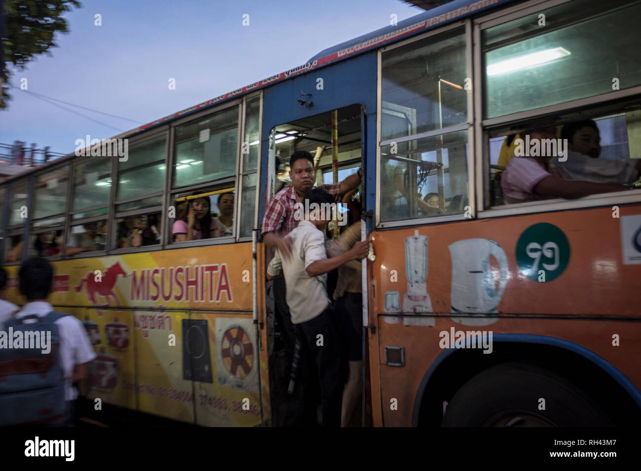Entering a bus hi-res stock photography and images - Alamy