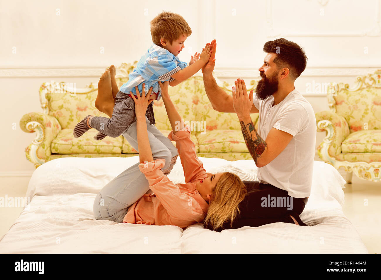 Little boy with dad and mom. happy family and childrens day. father and ...