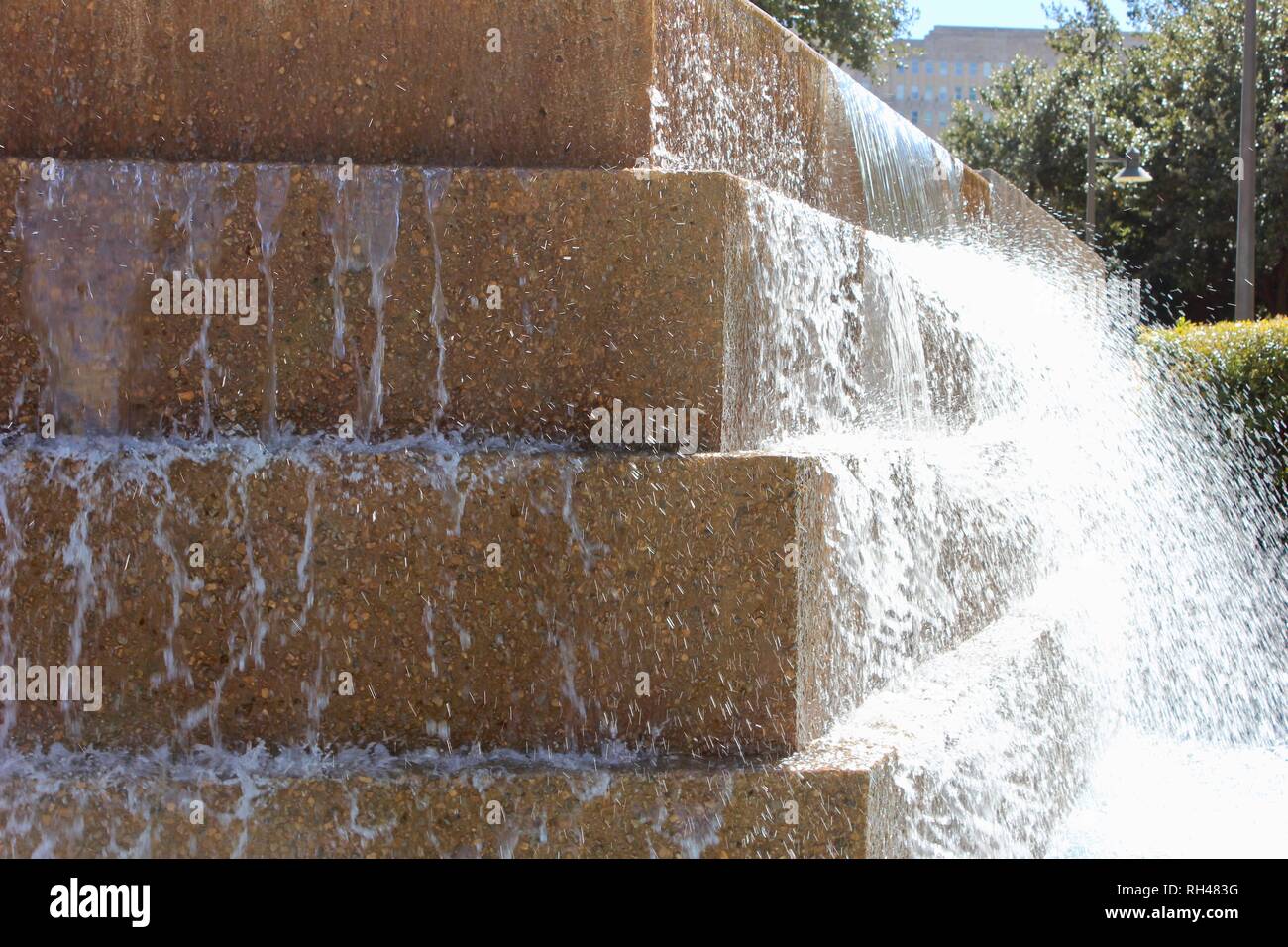 Water Flowing Down Steps on a Fountain Stock Photo - Alamy