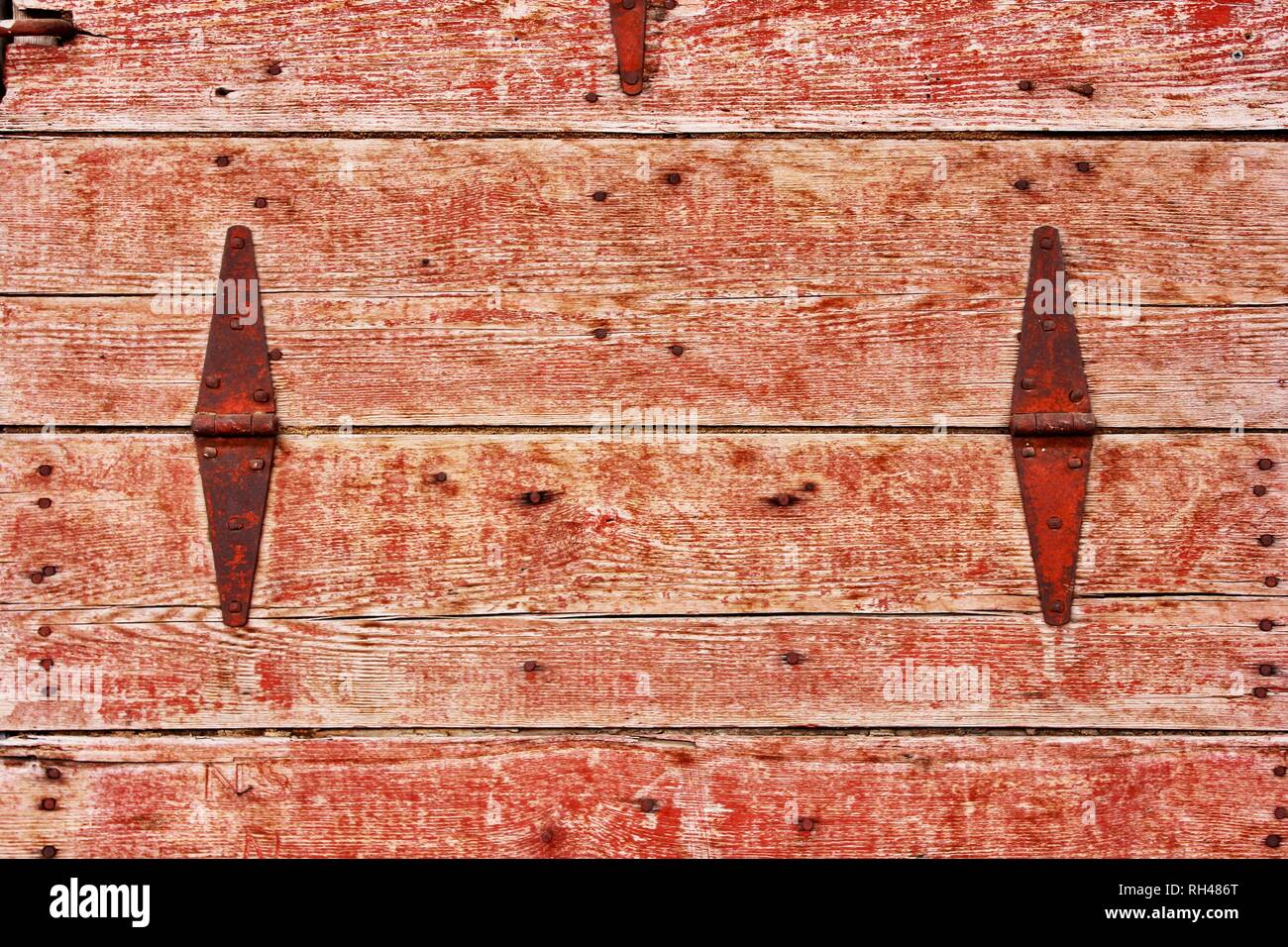 Rustic Red Door with Hinges Close Up Background Stock Photo - Alamy