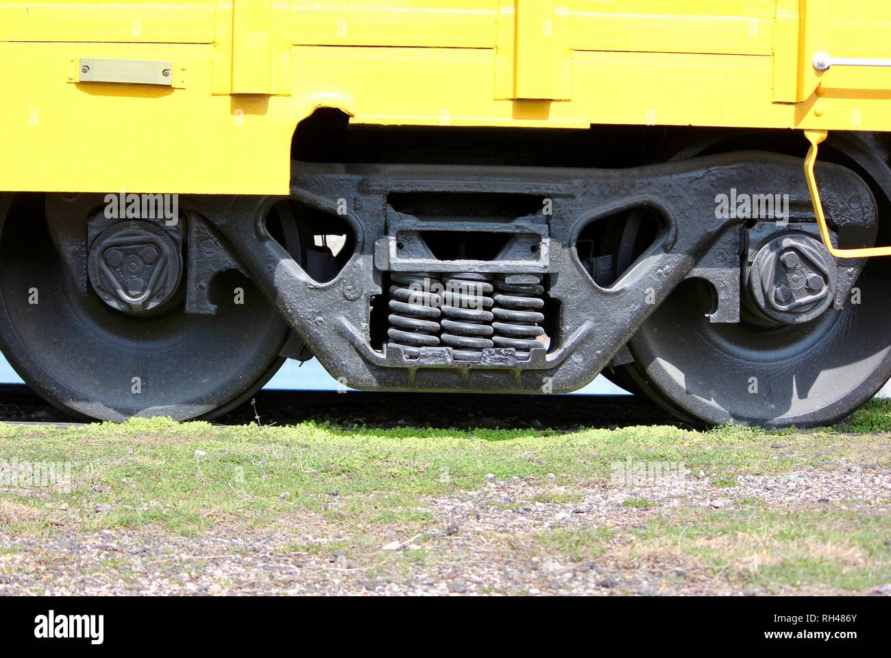 Yellow Train Wheels on a Track Up Close Stock Photo - Alamy