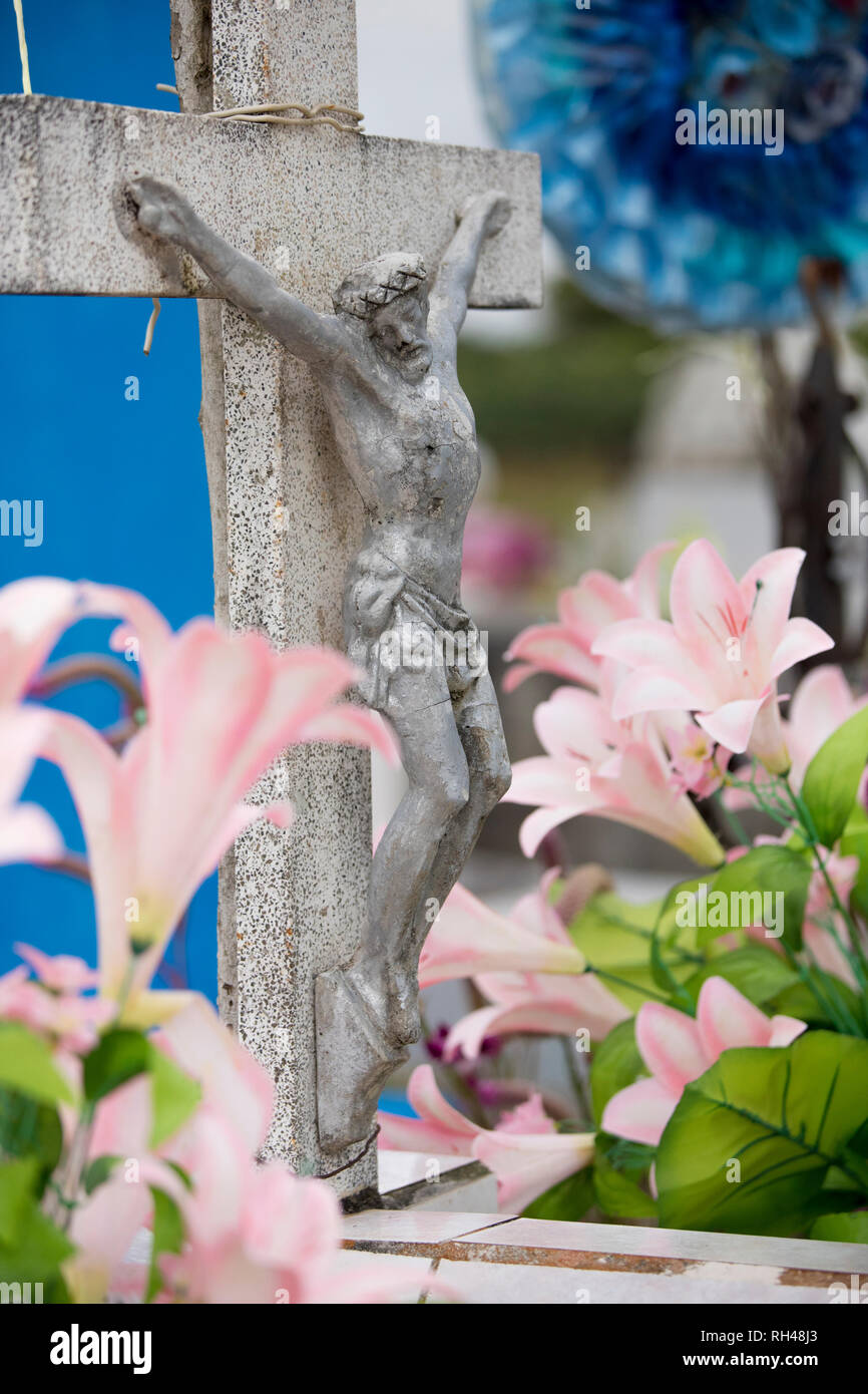 A crucifix is surrounded by decoration of flowers for the Day of the ...