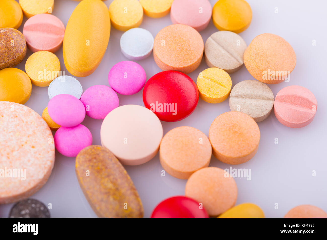 Tablets pills capsule heap mix therapy drugs, over a white background ...