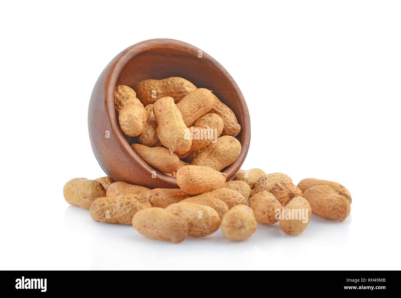 Peanut in wooden cups isolated on white background Stock Photo - Alamy