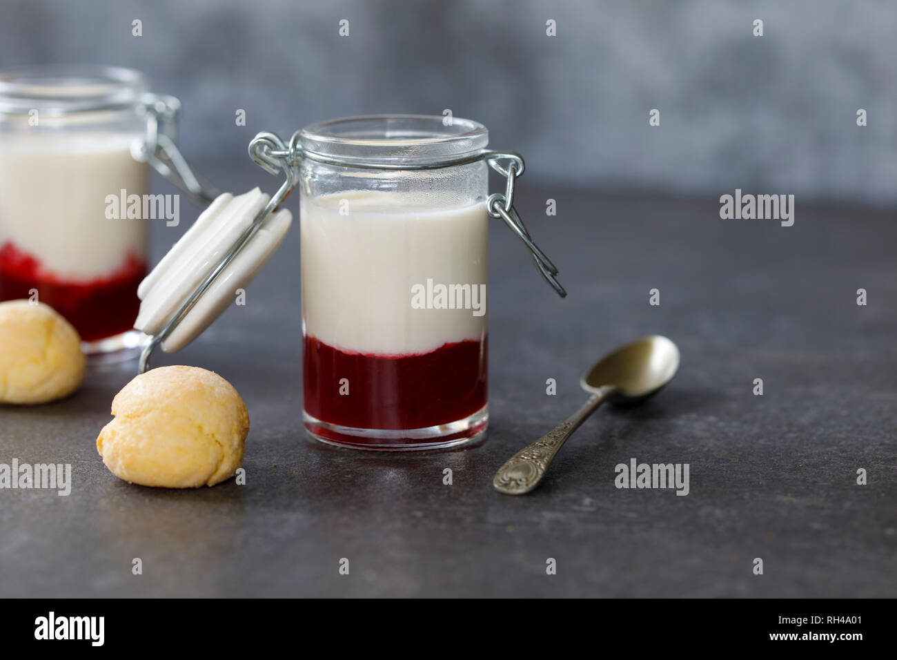 Layered panna cotta with raspberry, vanilla and amaretto biscuit Stock ...