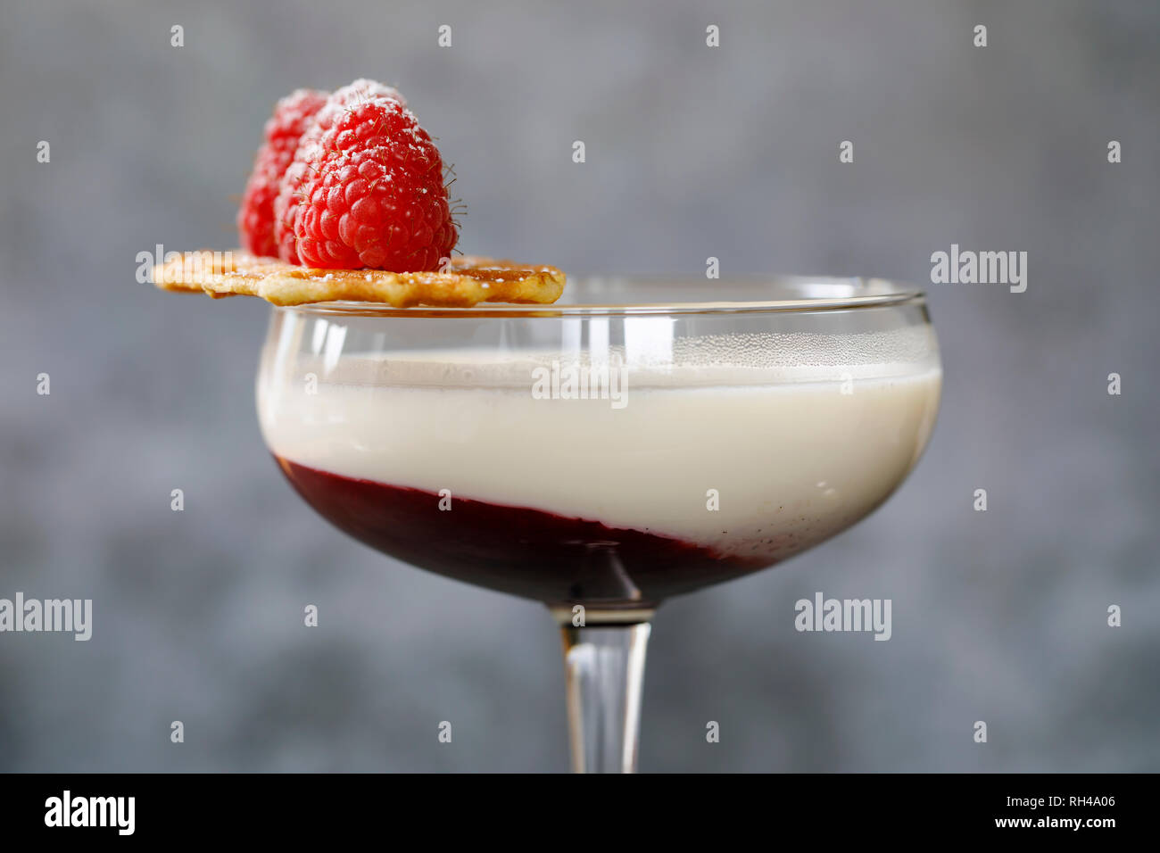 Layered panna cotta with raspberry, vanilla and waffer biscuit Stock ...