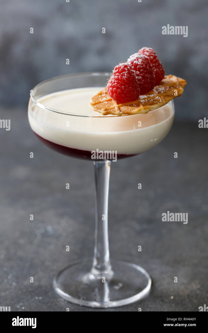 Layered panna cotta with raspberry, vanilla and waffer biscuit Stock ...