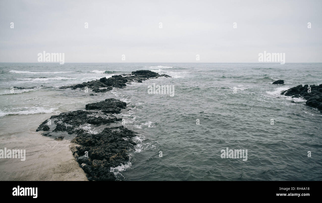 Volcanic rock beaches on the coast of Jeju Island, Seogwipo area Stock ...