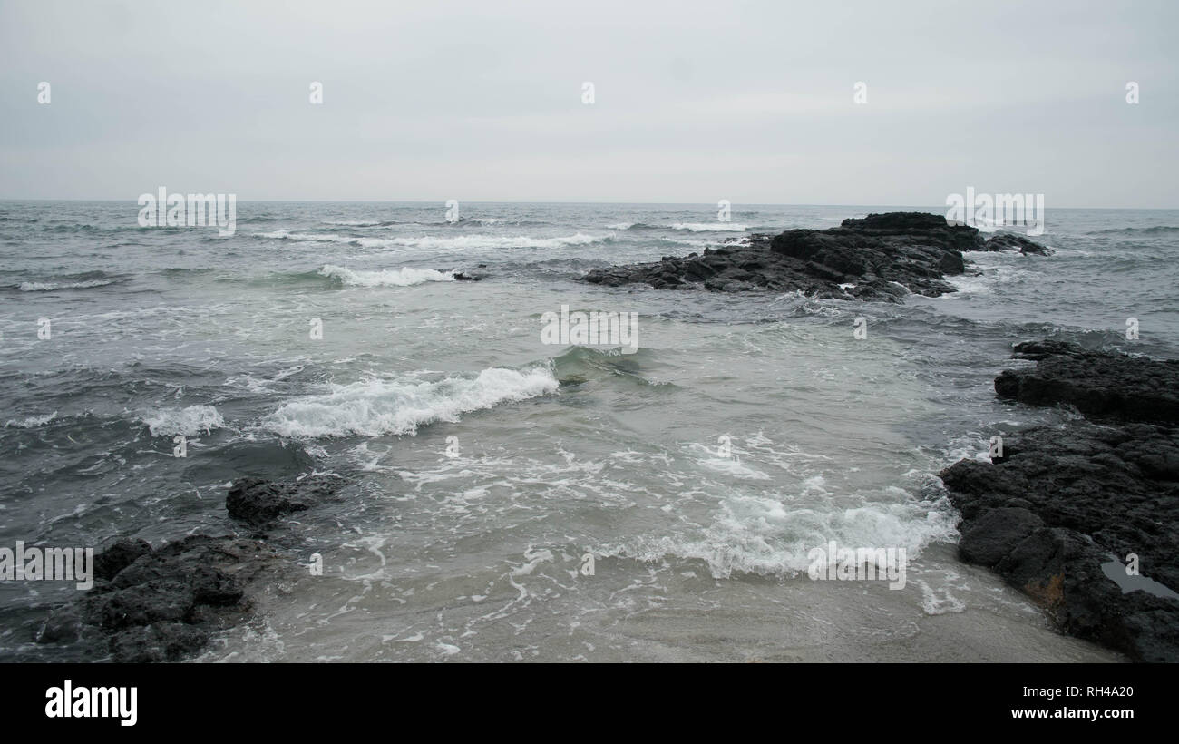 Volcanic rock beaches on the coast of Jeju Island, Seogwipo area Stock ...