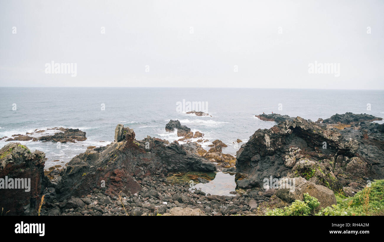 Volcanic rock beaches on the coast of Jeju Island, Seogwipo area Stock ...