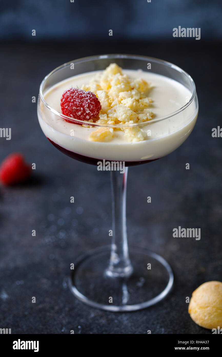 Layered panna cotta with raspberry, vanilla and amaretto biscuit Stock ...
