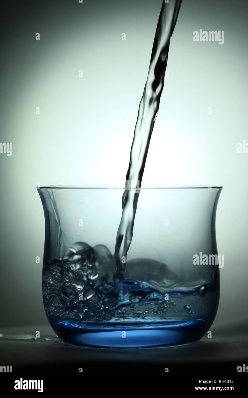 water splashing into a glass Stock Photo - Alamy
