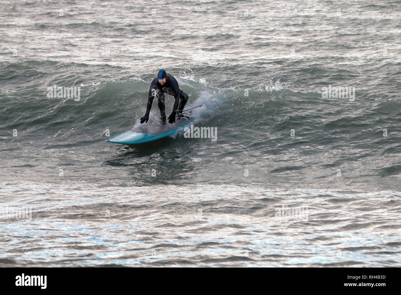 Catching a wave on a surfboard hi-res stock photography and images - Alamy