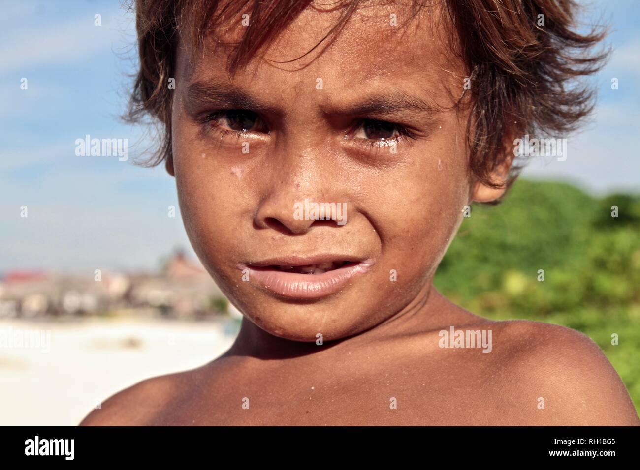 Portrait of an Indonesian boy crying Stock Photo - Alamy