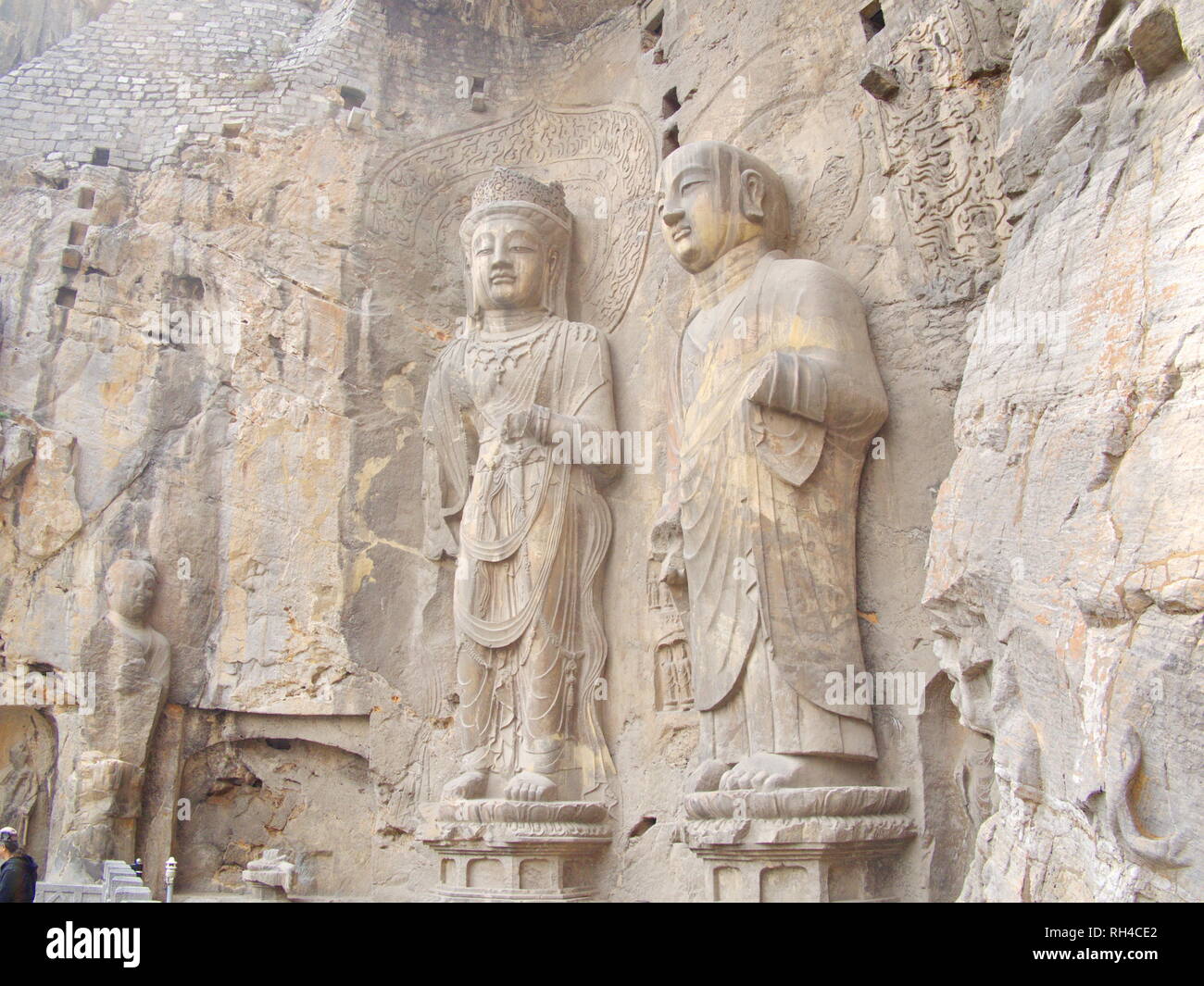 Luoyang Longmen grottoes. Broken Buddha and the stone caves and ...