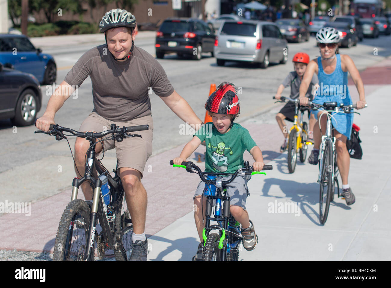 Family out for a bike ride Stock Photo - Alamy