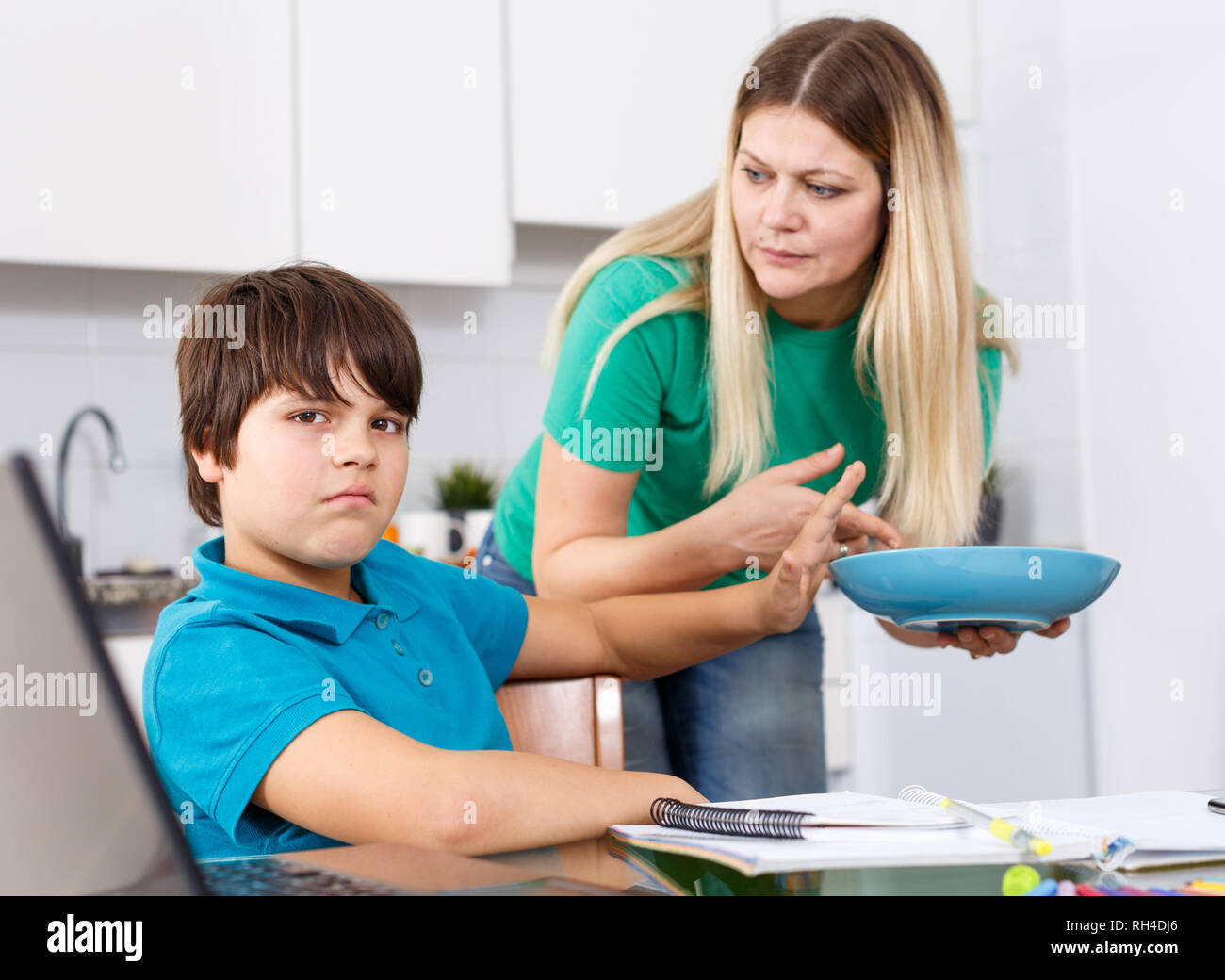 Portrait of displeased boy refusing to eat in kitchen interior Stock ...
