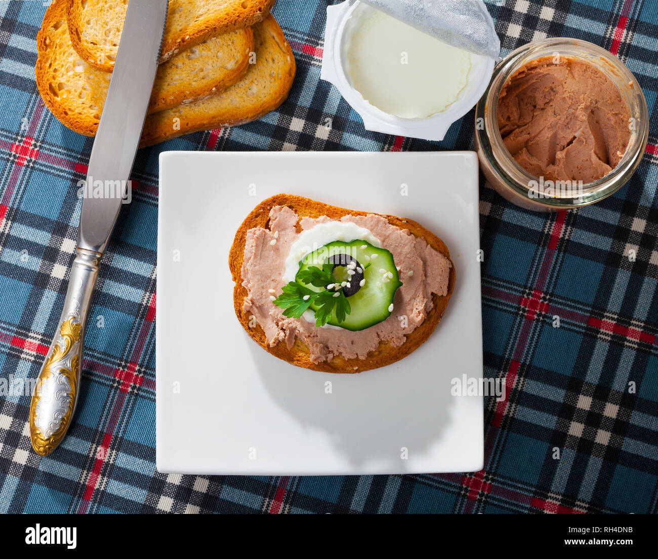 Canape with pate and young cheese and tomatoe at bread, served on ...