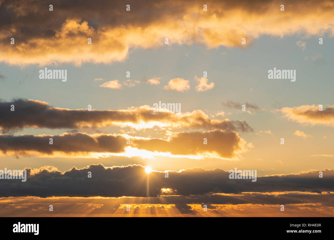Beautiful colorful golden hour sunset sky with cloud formation and ...