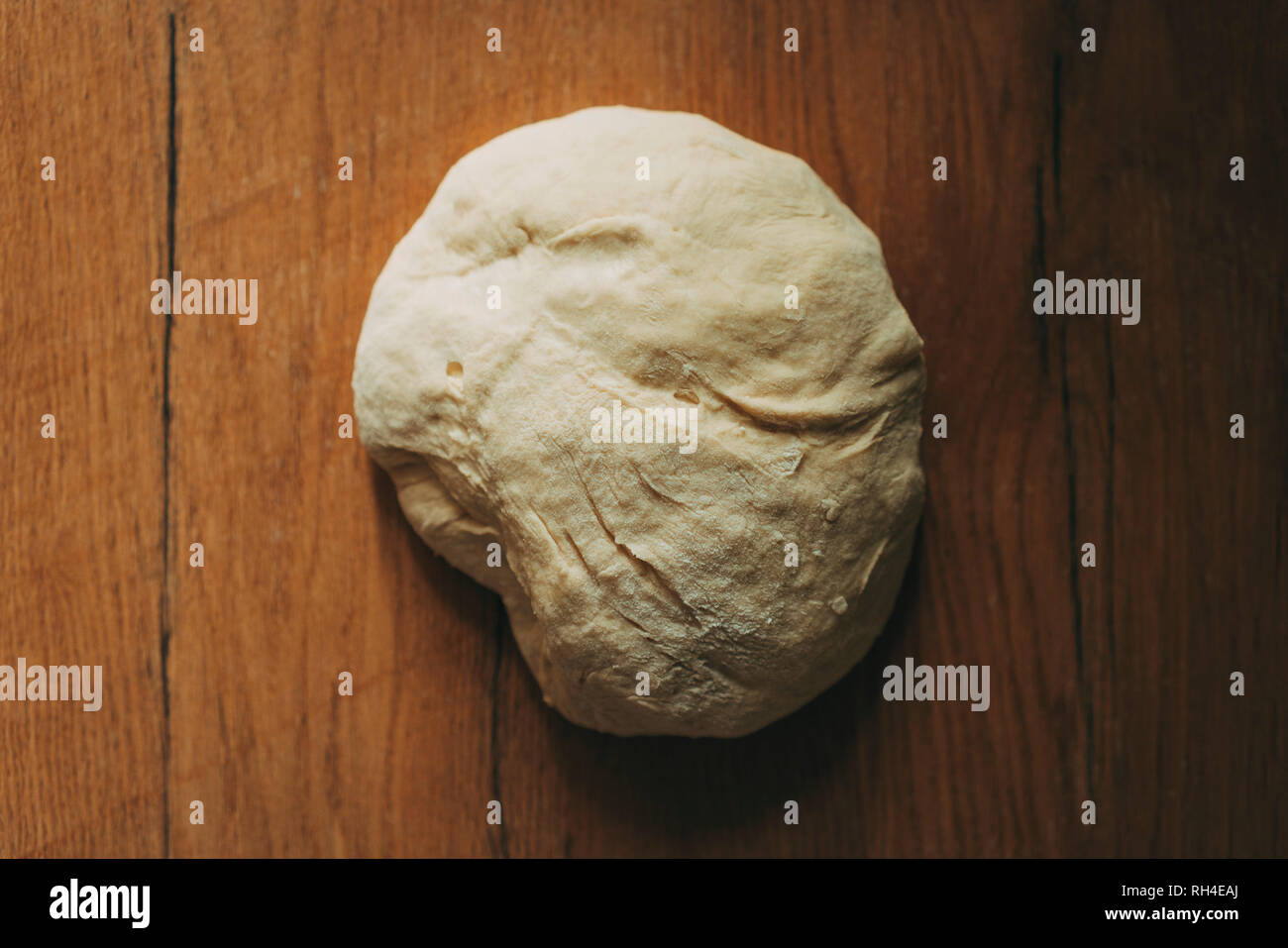Bread dough on rustic wooden surface Stock Photo - Alamy