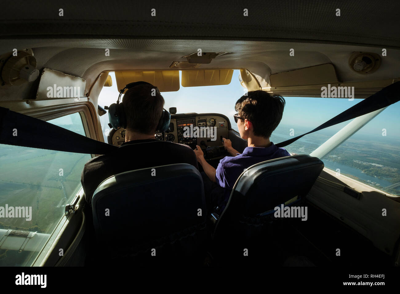 Father and son flying small airplane Stock Photo - Alamy