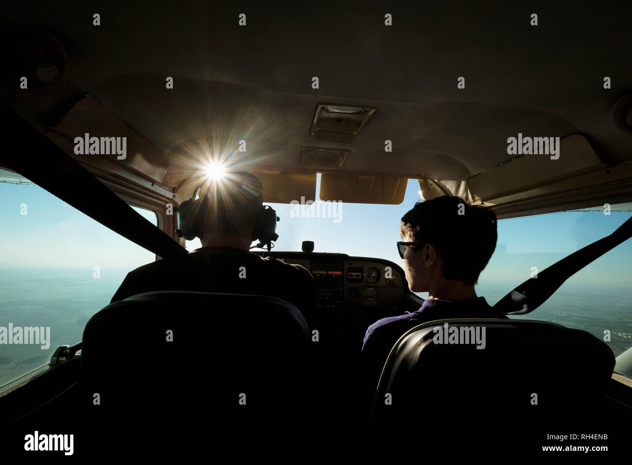 Father and son flying small airplane Stock Photo - Alamy