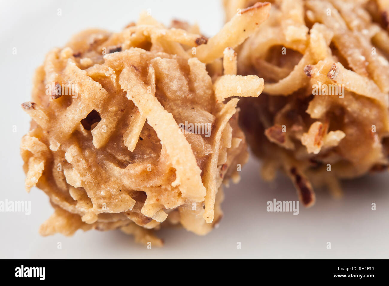 Colombian traditional coconut sweet called cocada in a white ceramic ...